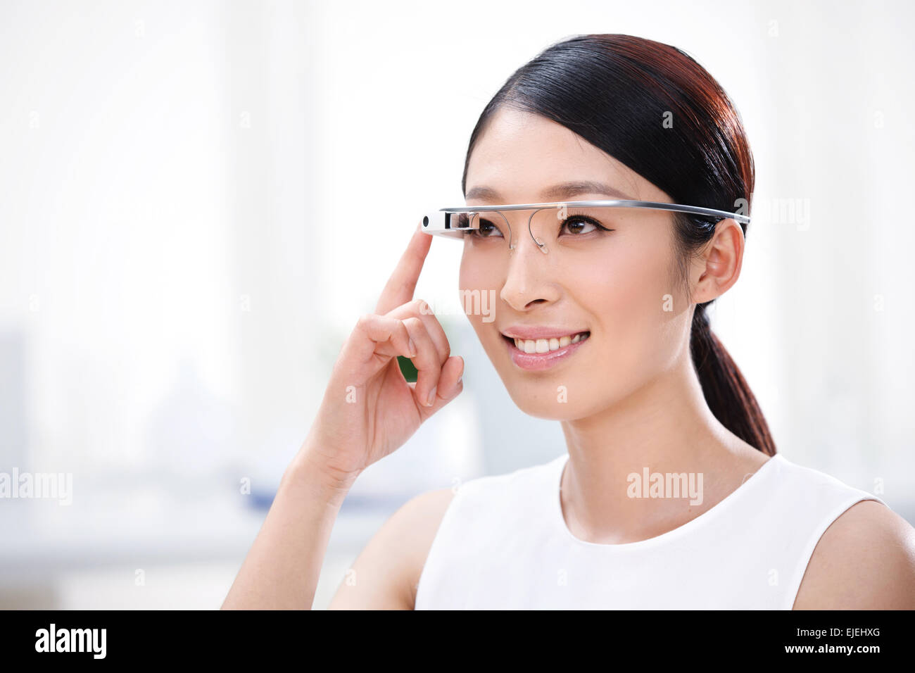 The young business women wearing Google glasses Stock Photo - Alamy