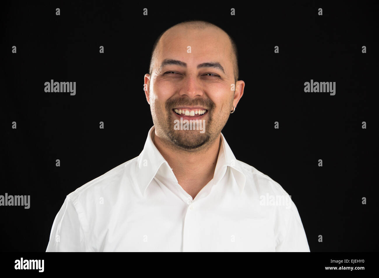 confident successful business man smiling isolated on black background ...
