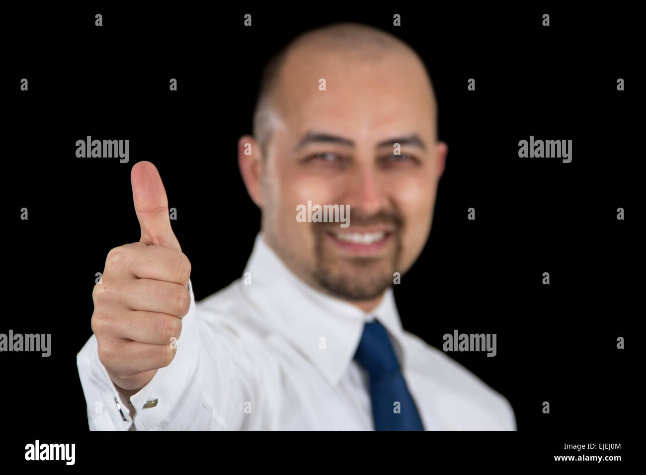 successful business man holding thumb up Stock Photo - Alamy