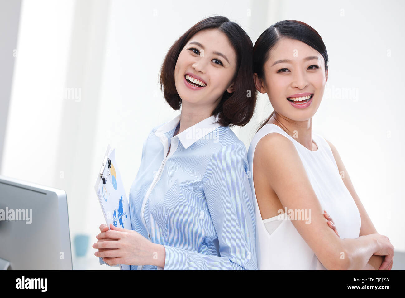 Happy business lady in the office Stock Photo - Alamy
