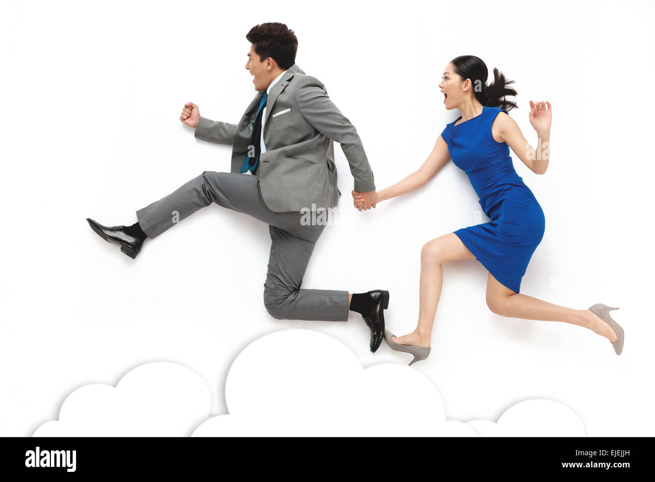 Business men and women holding hands run Stock Photo - Alamy