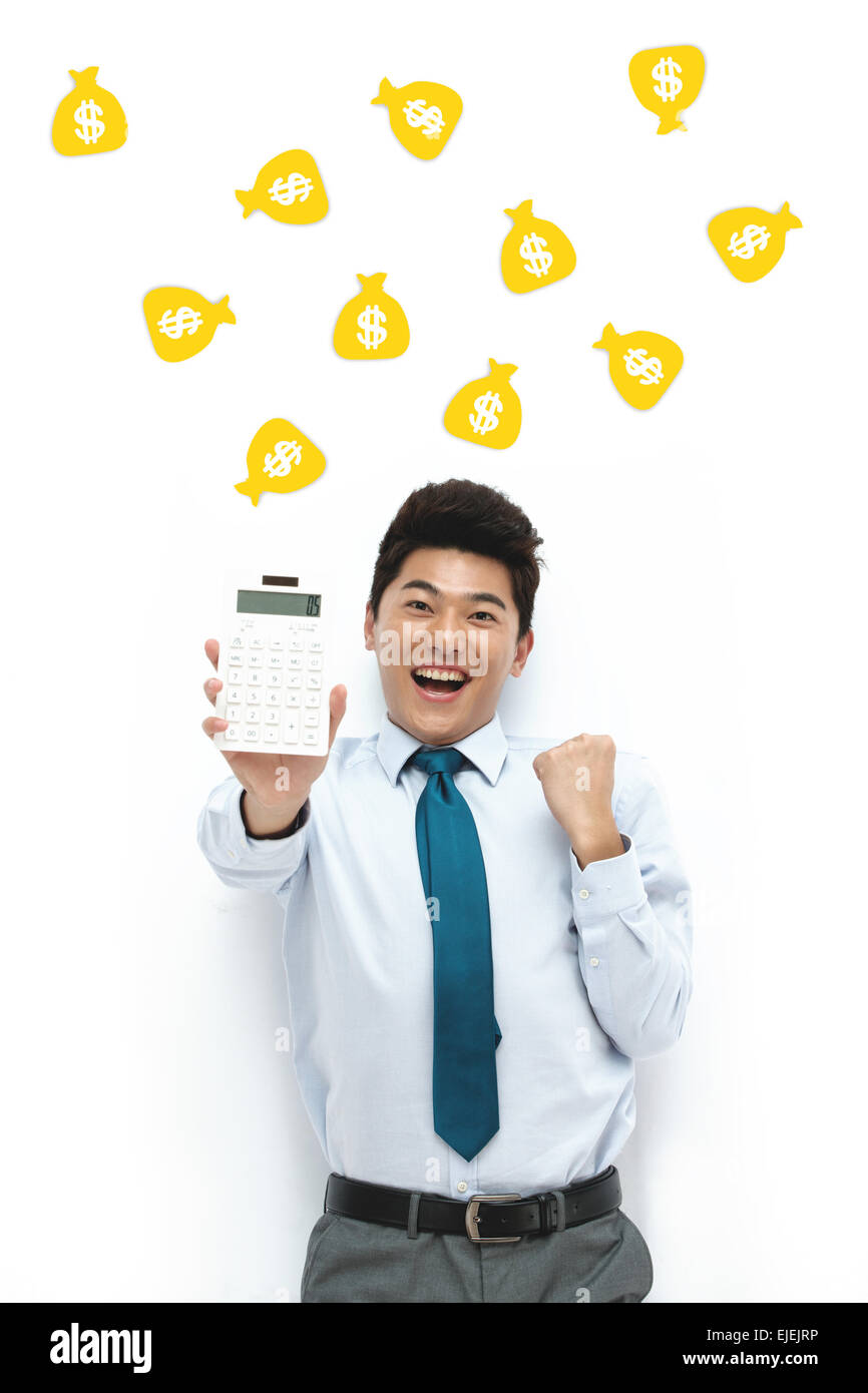 A young business man holding a calculator Stock Photo - Alamy
