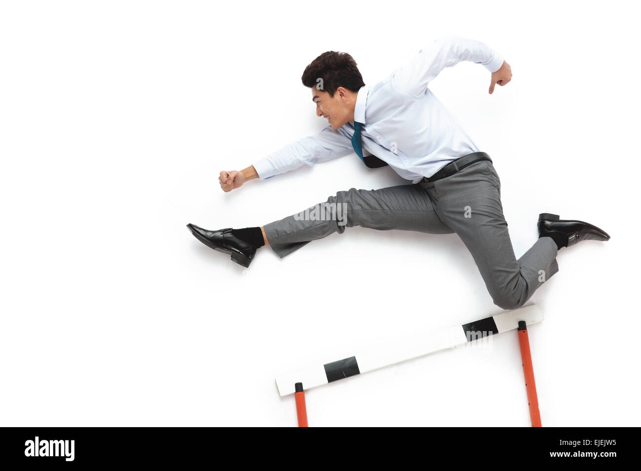 A young man of business hurdle Stock Photo - Alamy