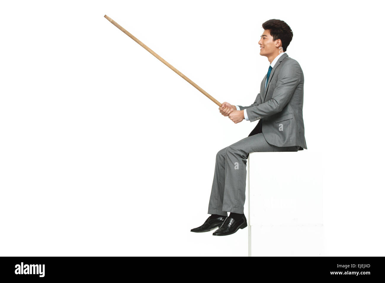Business young man holding a fishing rod Stock Photo - Alamy