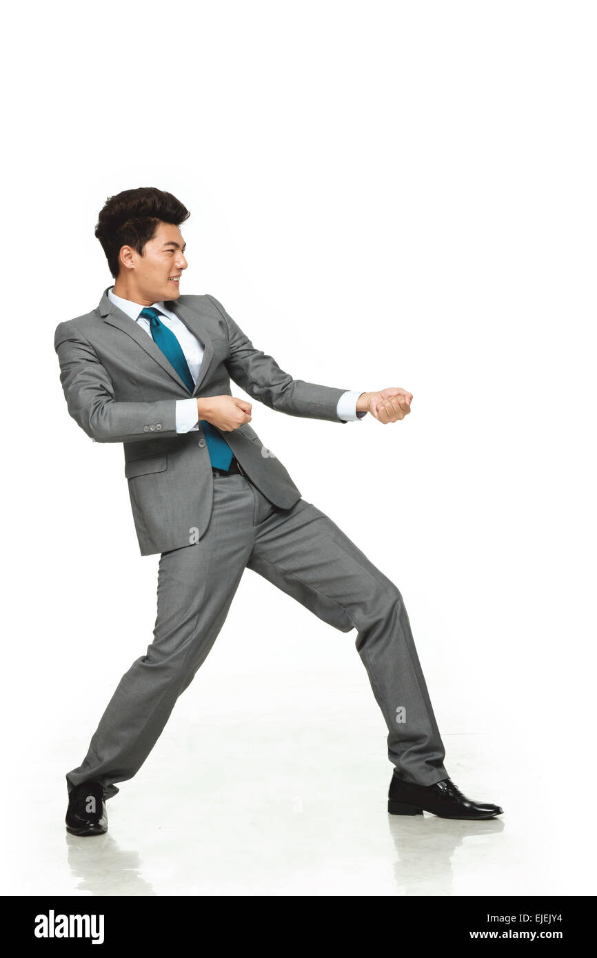 Business men do pull posture Stock Photo - Alamy