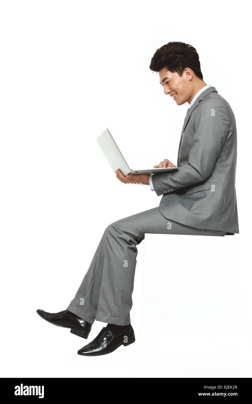 The young men to use computer business Stock Photo - Alamy