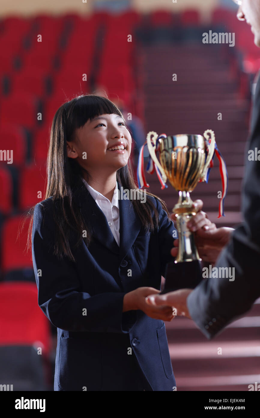 The international primary school teacher was giving pupils Awards Stock ...