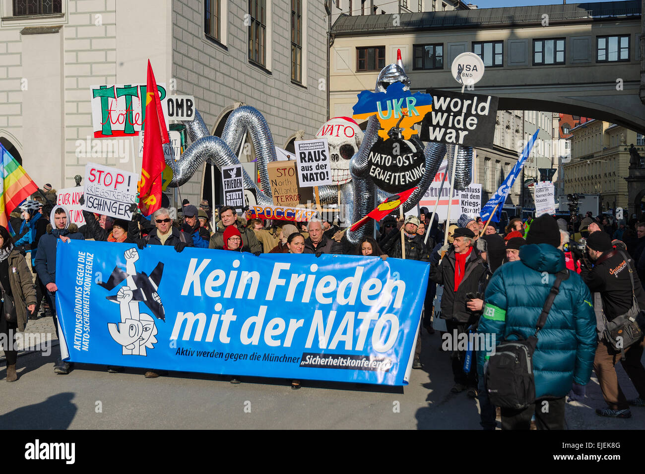 European anti-NATO peaceful protest demonstration. Texts on banners and ...