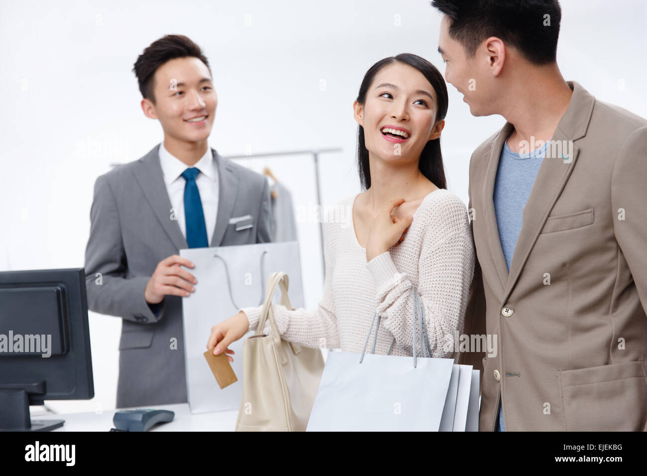 Young couples to buy clothes in the clothing store Stock Photo - Alamy