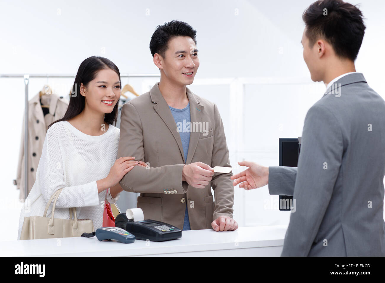 Young couples in the clothing store to buy clothes Stock Photo - Alamy