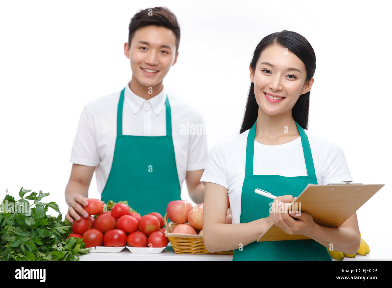Supermarket sales staff sell fruit and vegetables Stock Photo - Alamy