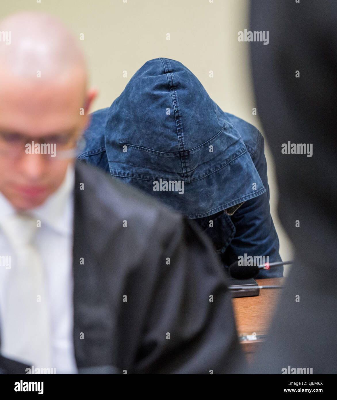 Munich, Germany. 25th Mar, 2015. The defendant, Carsten S., sits in the ...