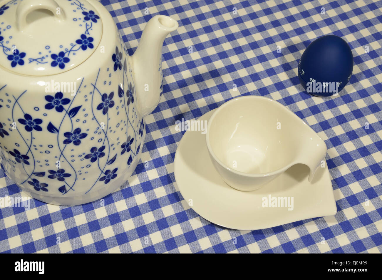 Pot, cup and timer clock. Tea time Stock Photo - Alamy