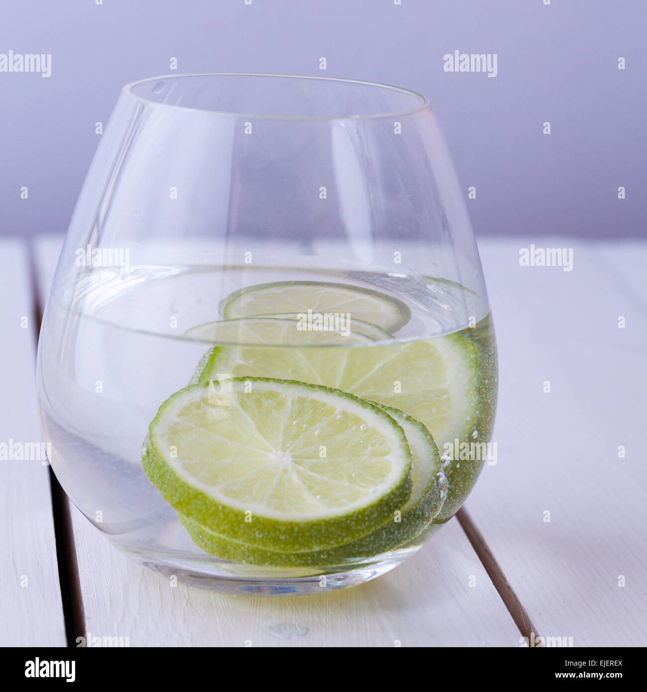 refreshing glass of water with slices of lime Stock Photo - Alamy