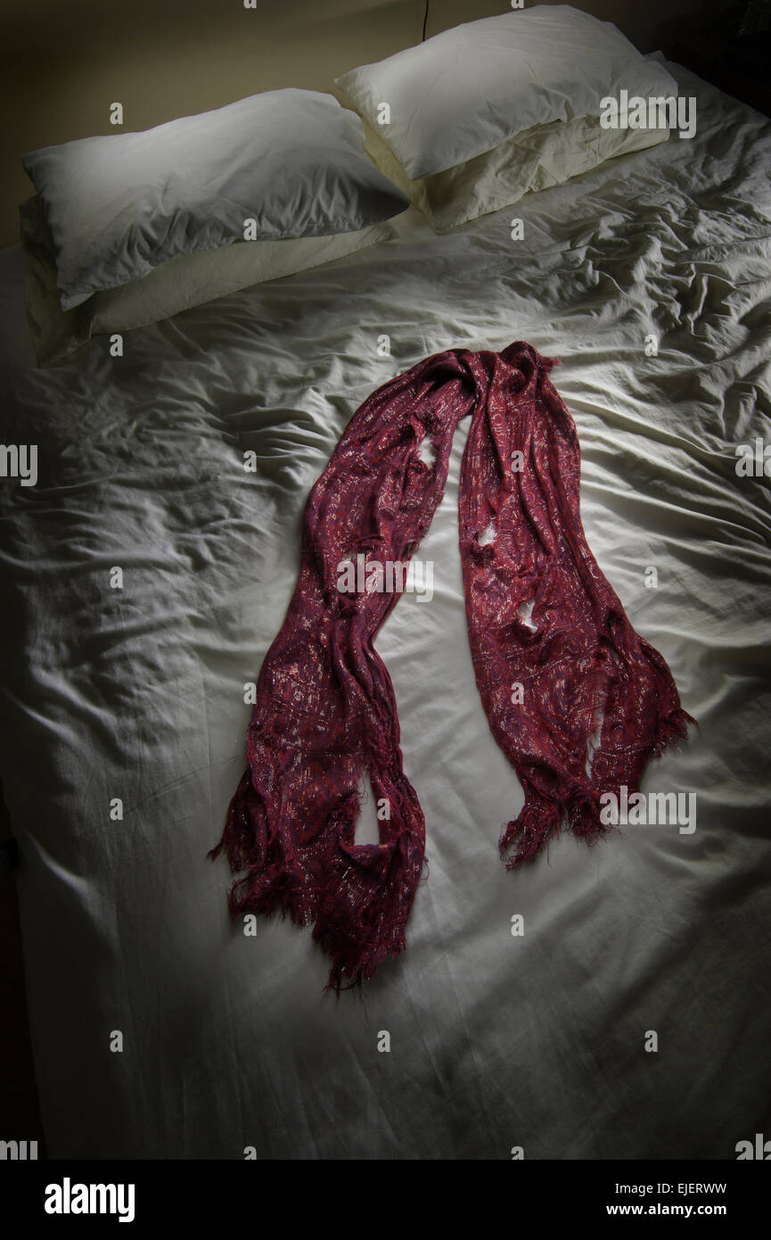 Torn Clothing On Bed Stock Photo - Alamy