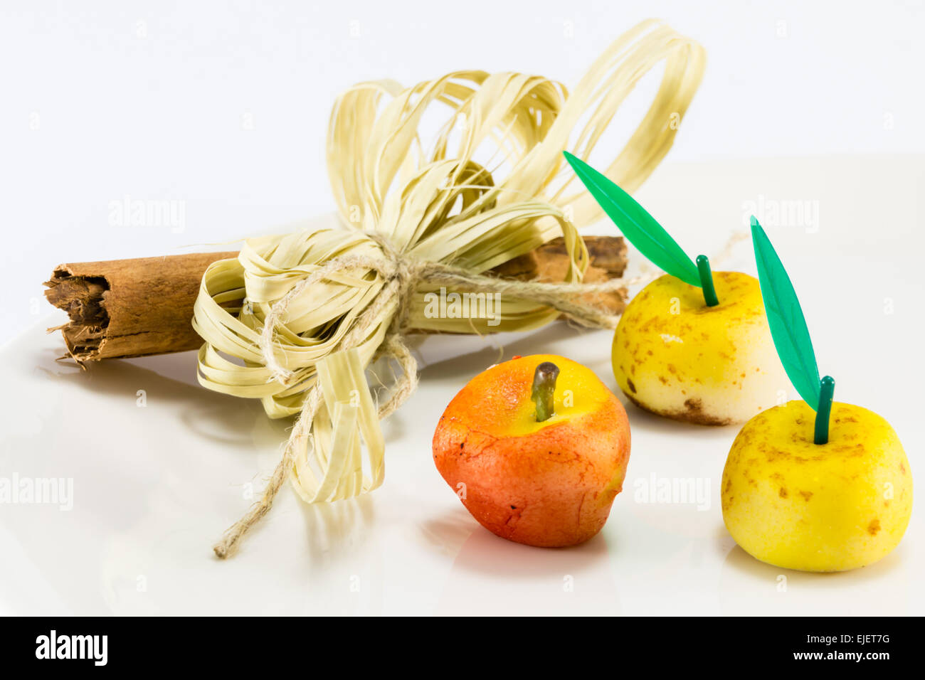 red and yellow marzipan apple fruits with cinnamon spicy stick Stock ...
