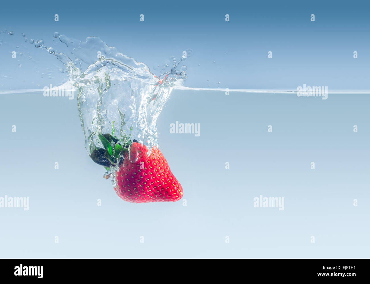 Strawberry in water Stock Photo - Alamy
