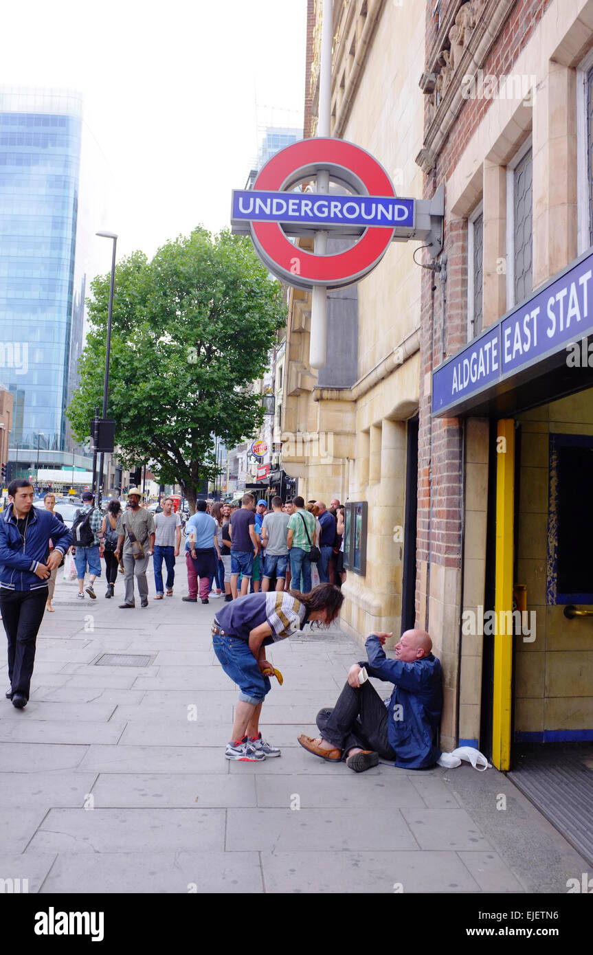 Woman spitting on homeless man hi-res stock photography and images - Alamy