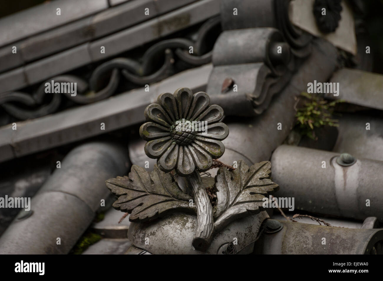 Detail of an elaborate roof tile shaped like a flower in Kyoto, Japan ...