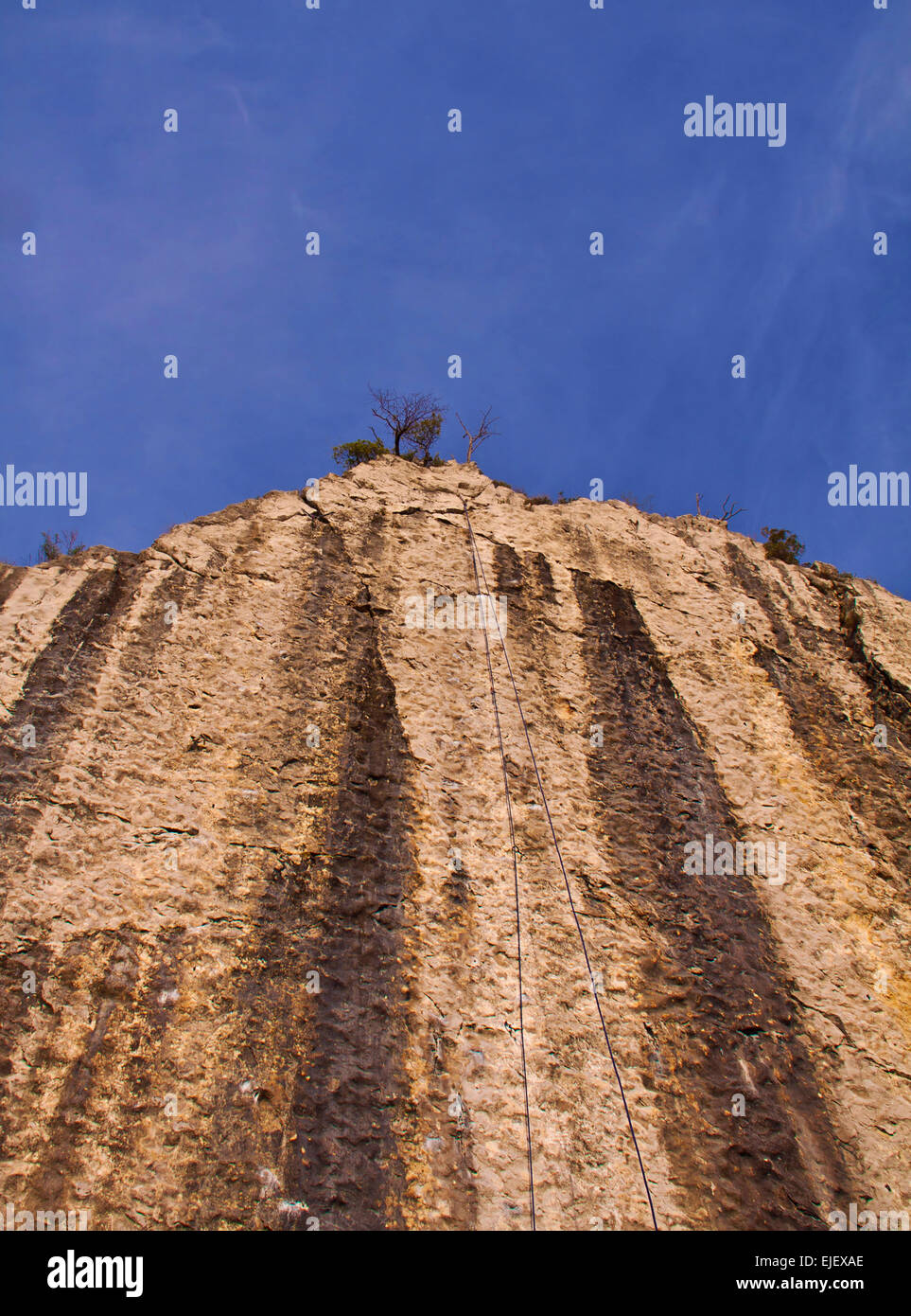 6-grade climbing route on a stone vertical wall; used as crag for ...