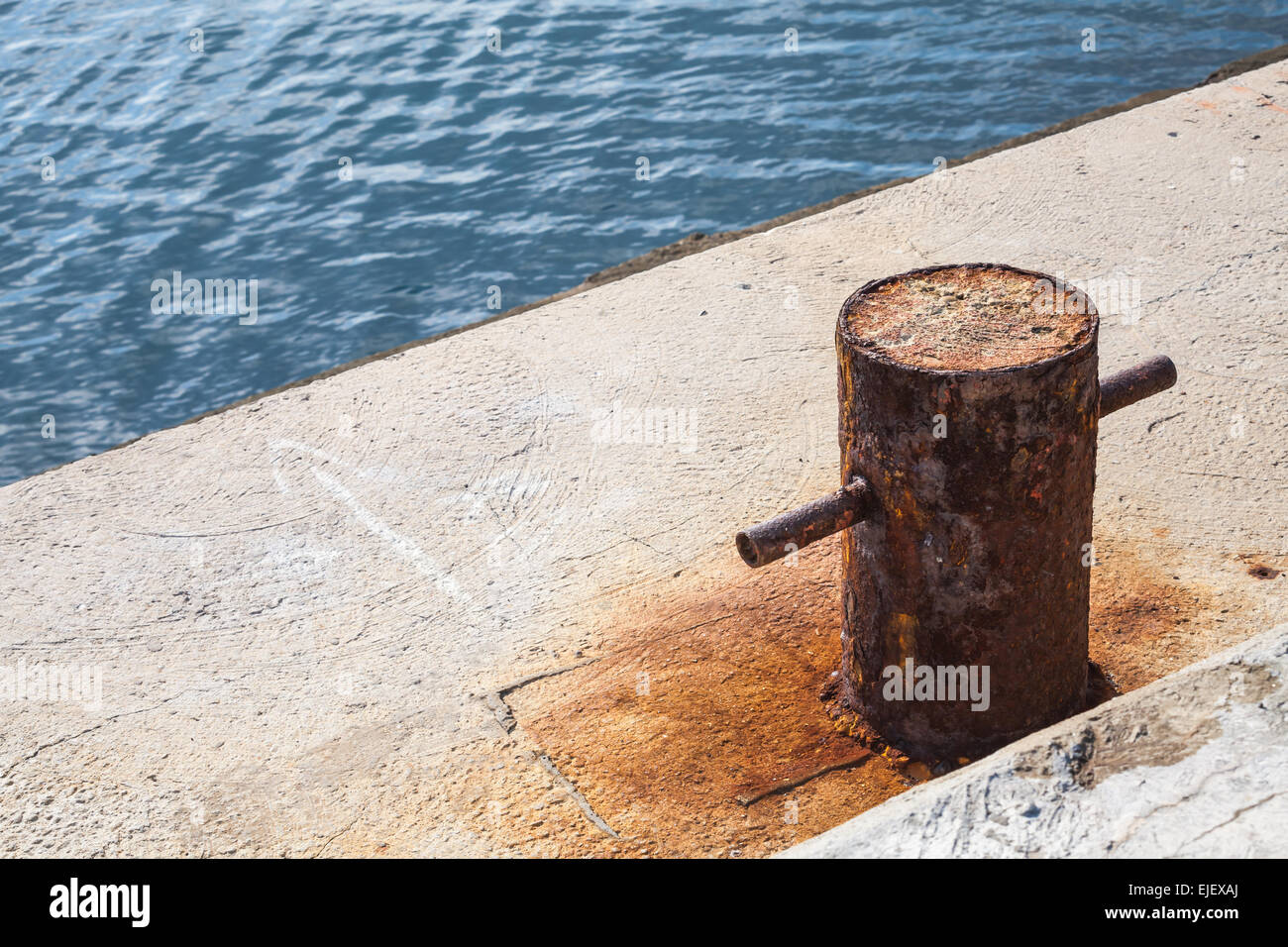 Old rusted mooring bollard on concrete pier, Black sea coast Stock ...