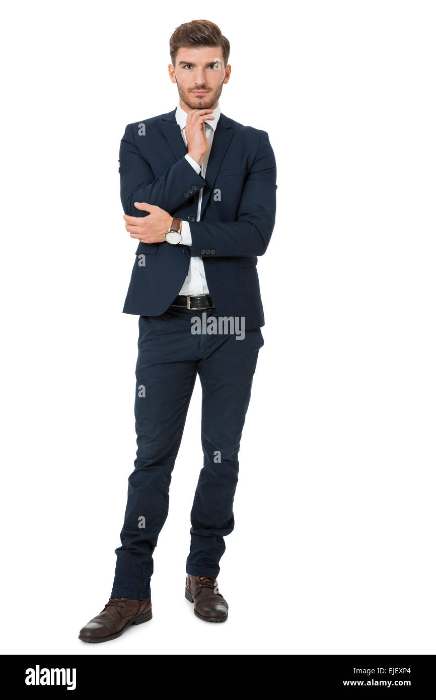 Stylish successful handsome young businessman standing in a relaxed ...