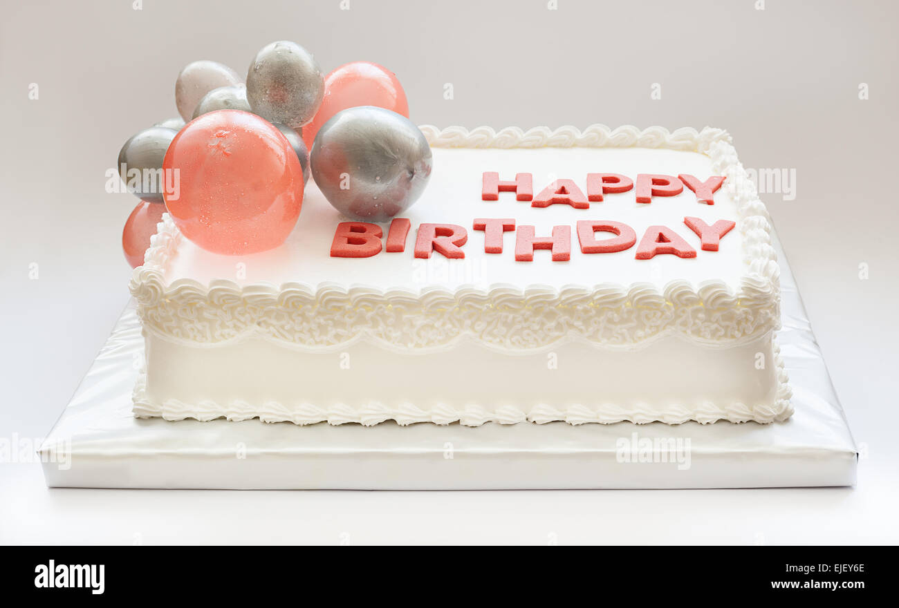 Details of a happy birthday cake, on white background Stock Photo - Alamy