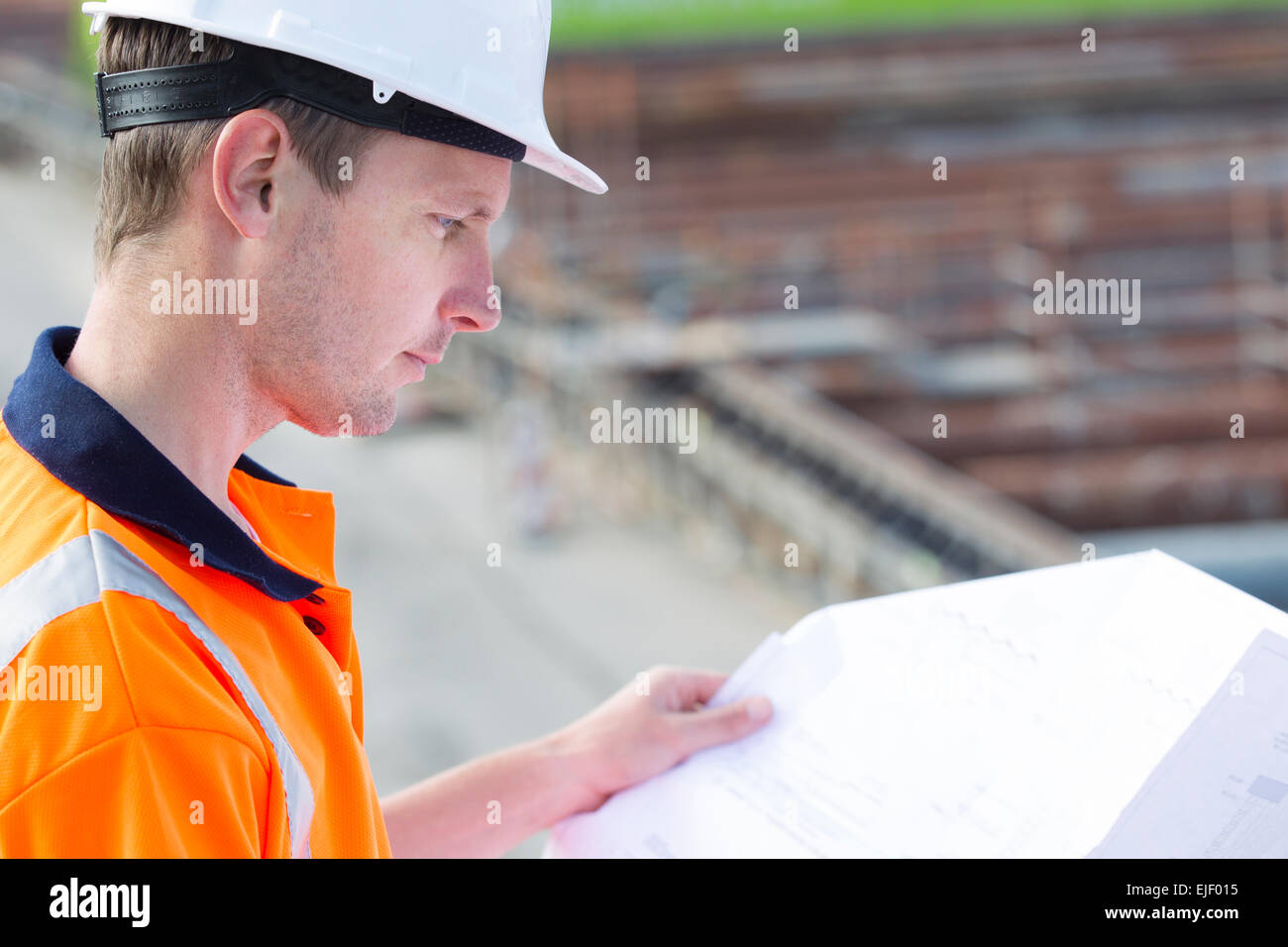 Man working at construction site, helmet Stock Photo - Alamy
