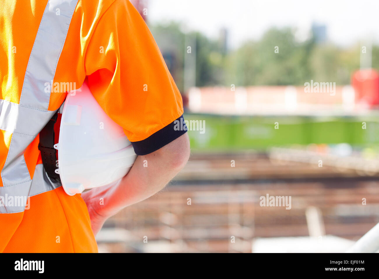 Man working at construction site, helmet Stock Photo - Alamy