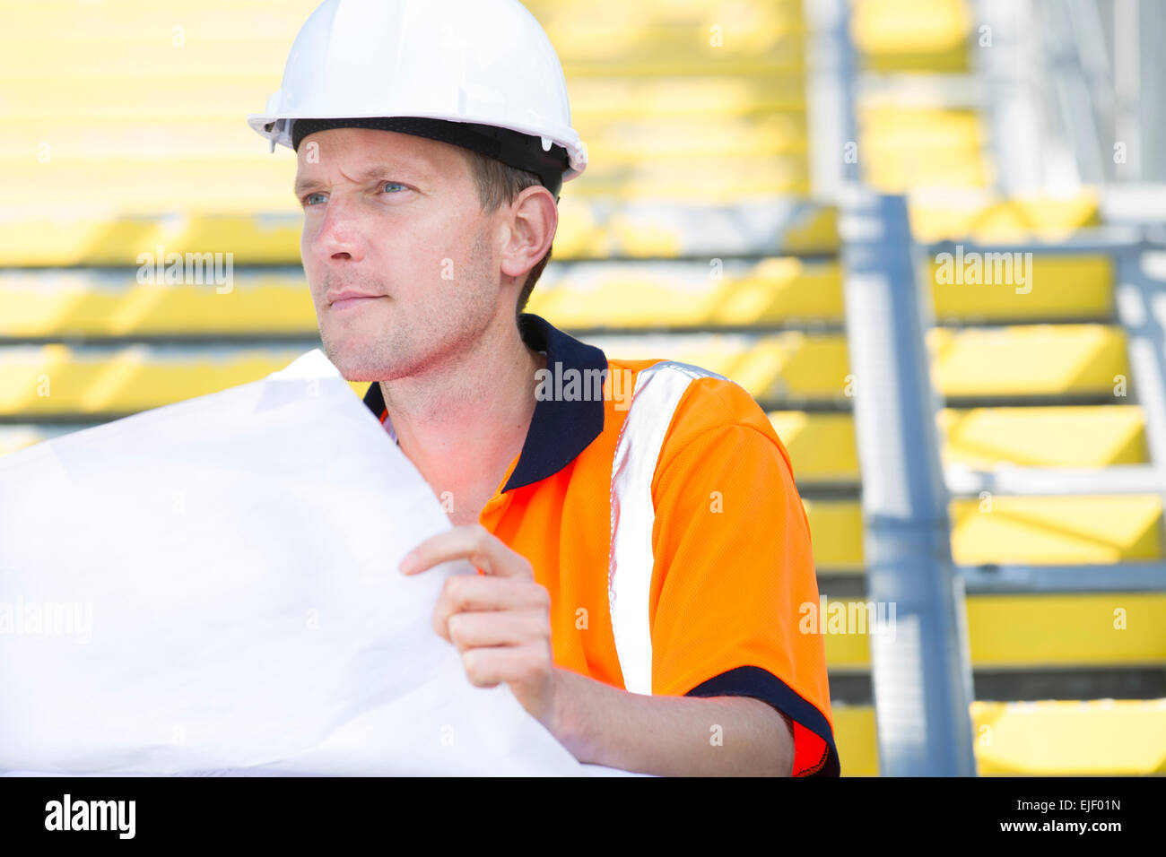 Man working at construction site, helmet Stock Photo - Alamy