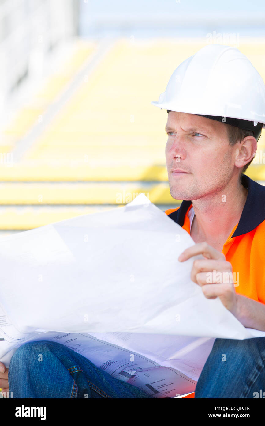 Man working at construction site, helmet Stock Photo - Alamy