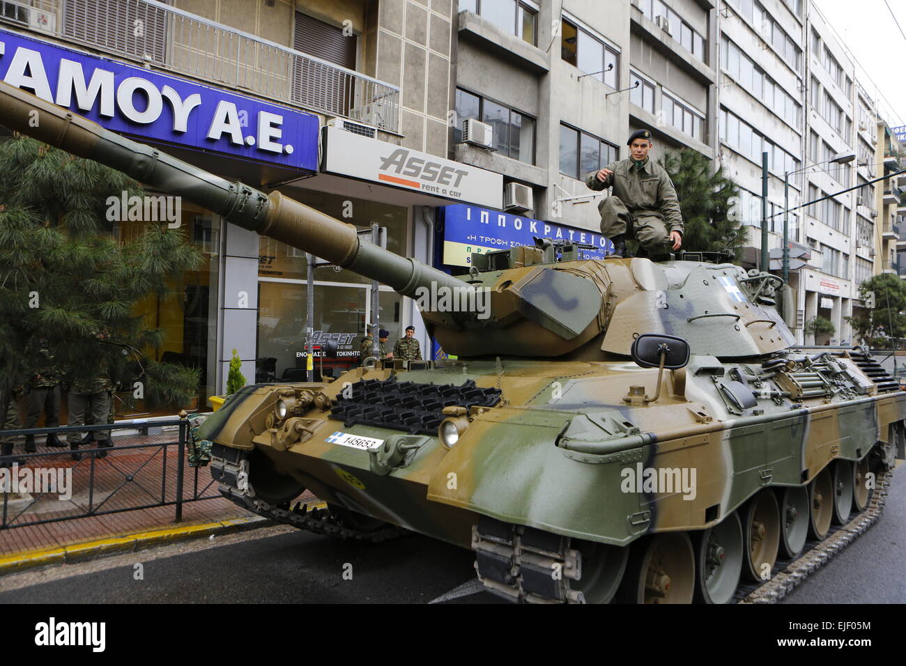 Athens, Greece. 25th Mar, 2015. A soldier poses on top of a a German ...