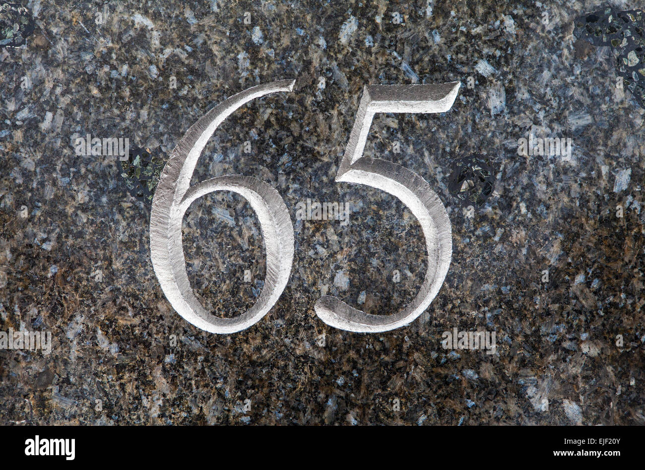 The Number 65 on a wall Stock Photo - Alamy