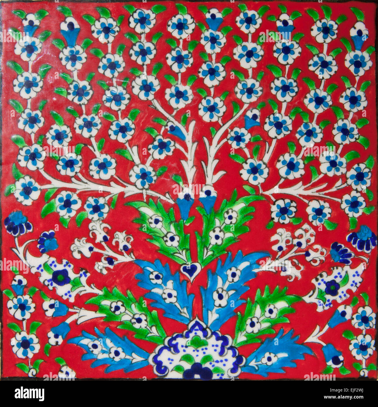 Red elegant tile with motif of beautiful Iznik style flowers ...