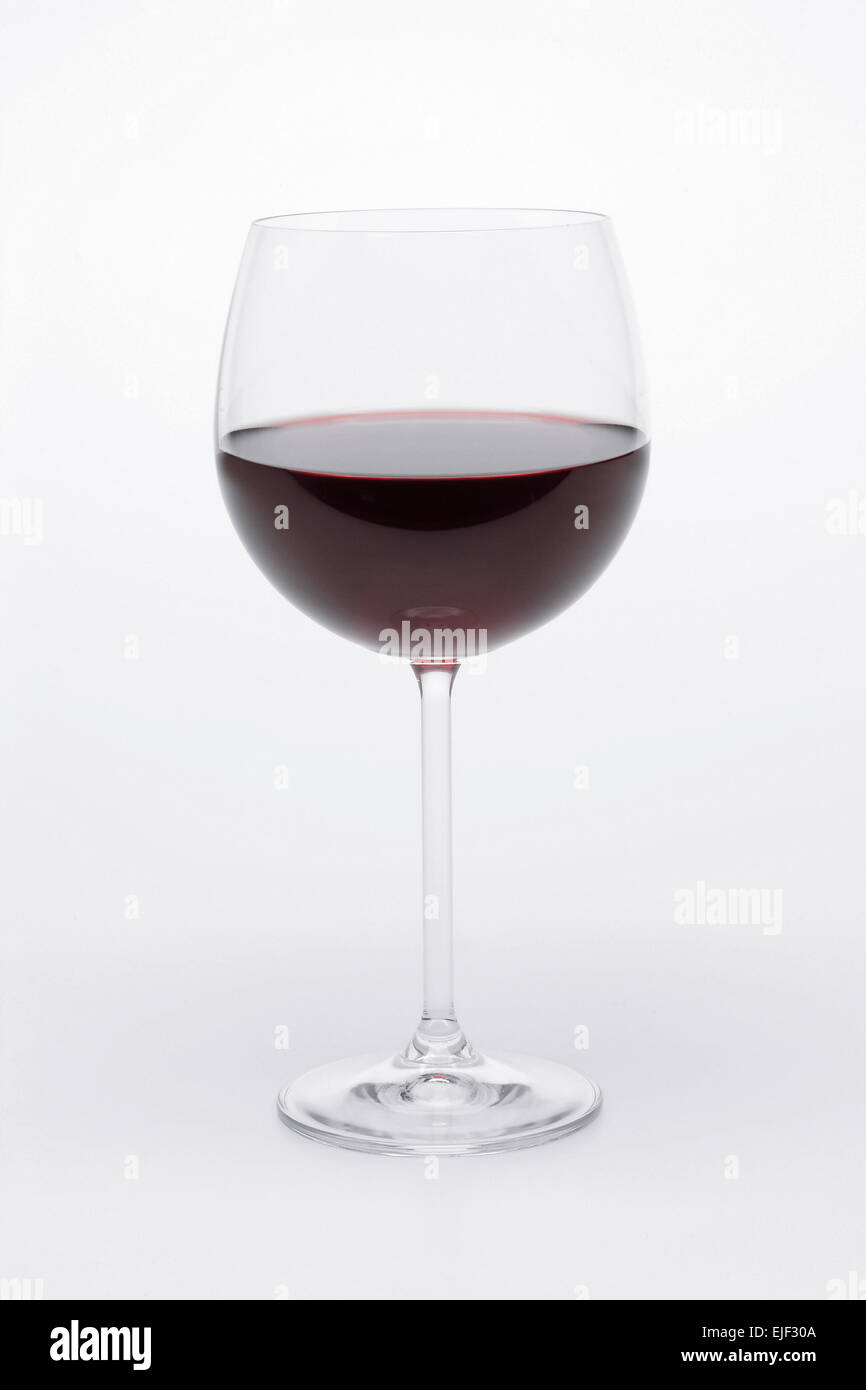 Single glass of red wine on a white background Stock Photo - Alamy