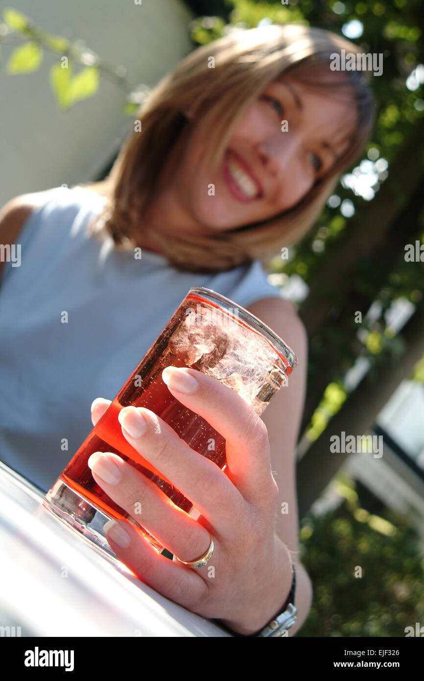 Young adults drinking in a pub. Male and female with ethnic diversity ...