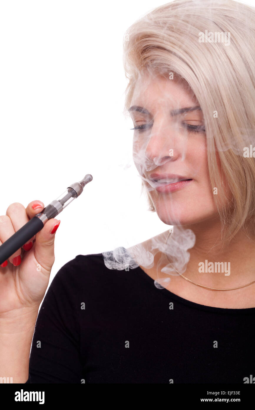 Young woman exhaling smoke hi-res stock photography and images - Alamy