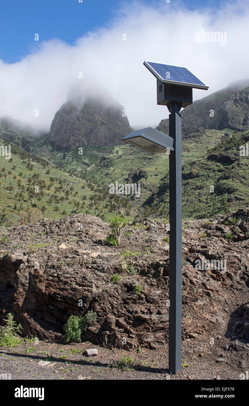 A solar panel powering a light in front of a volcano fumerole in La ...