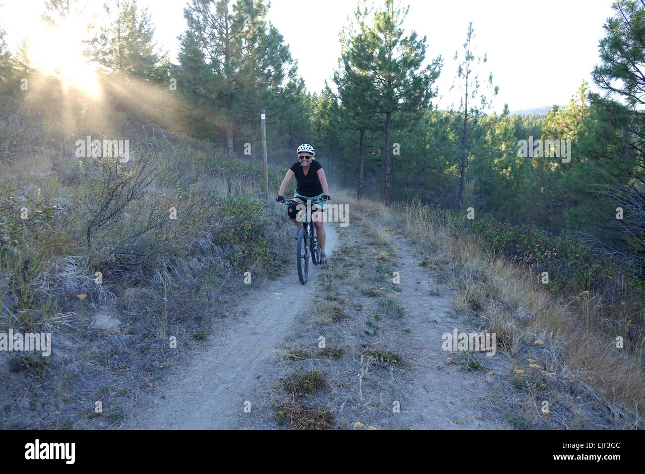 A mountain biker rides a trail at Echo Ridge Multi-use trail system in ...