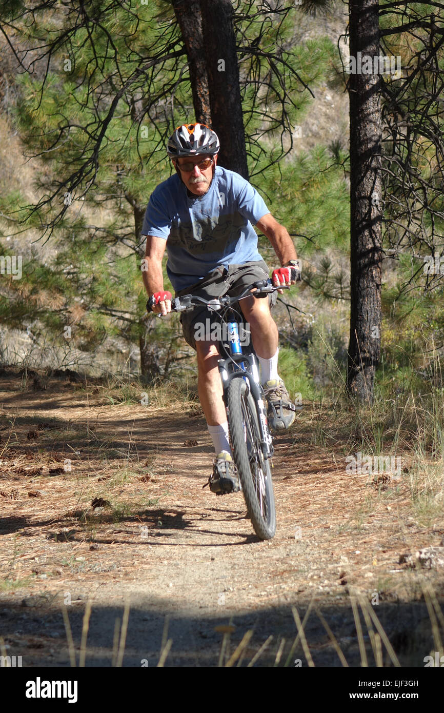 A mountain biker negotiates a single track trail at Echo Ridge in the ...