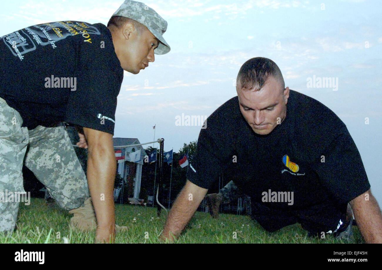 Sgt. 1st Class Brian Eisch performs pushups during the July 14 opening ...