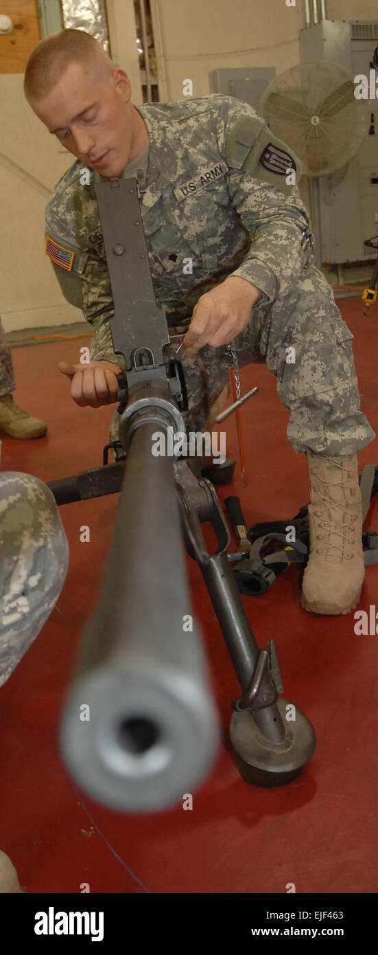 Spc. David Obray of the U.S. Army Reserve Command function checks a .50 ...