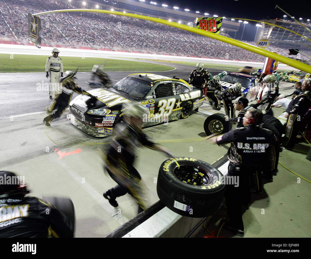 The Army team changes tires on the #39 Chevy Impala in the pit Sunday ...