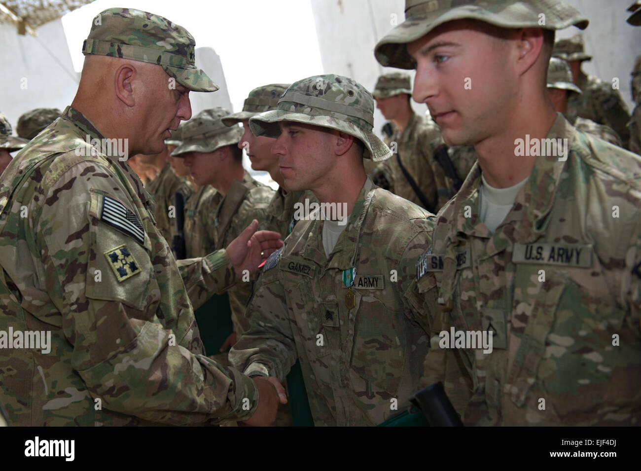 U.S. Army Chief of Staff Gen. Raymond T. Odierno shakes the hand of a ...