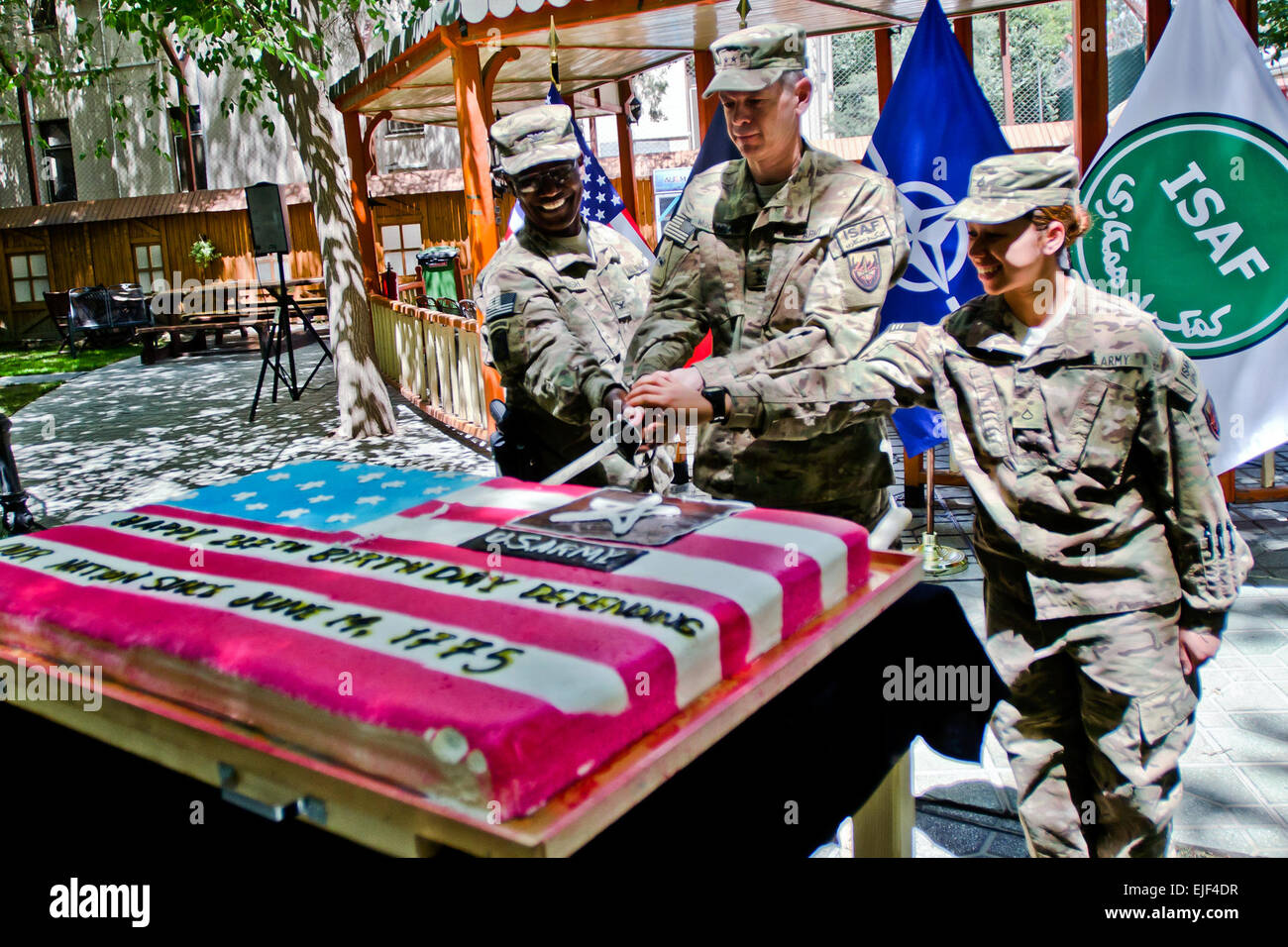 U.S. Army service members cut a cake during a ceremony commemorating ...