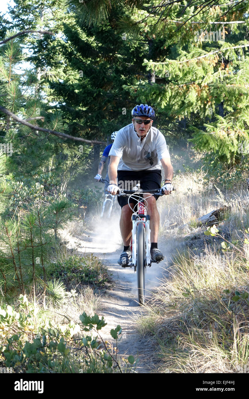 A mountain biker negotiates a single track trail at Echo Ridge in the ...