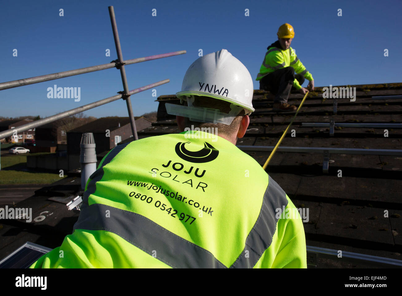 Solar panels being installed as part of a renewable green energy policy ...