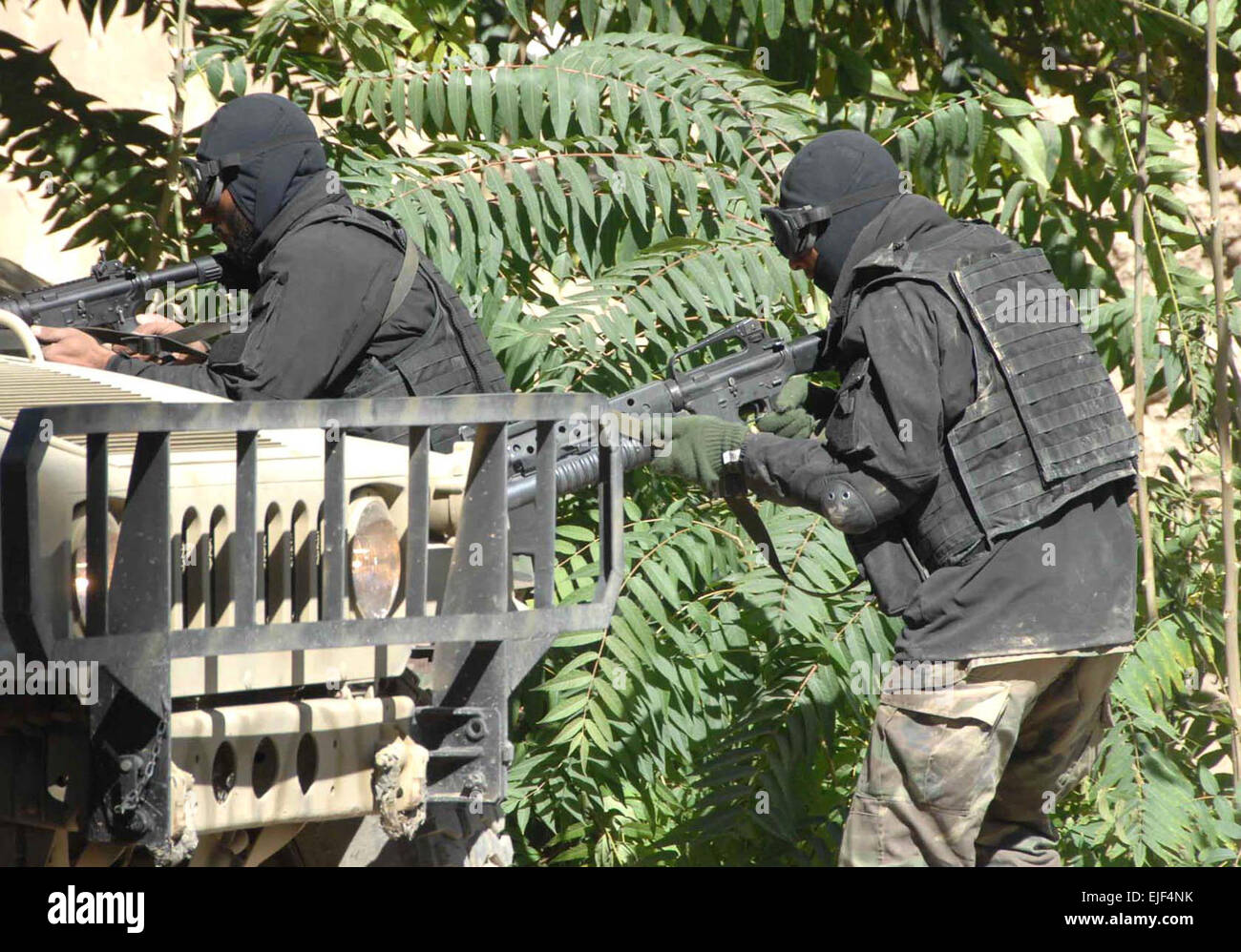 Afghan National Army commando cadets clear a vehicle during an ambush ...