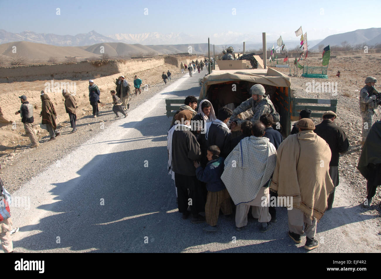 Local villagers receive humanitarian aid from the Bagram Provincial ...