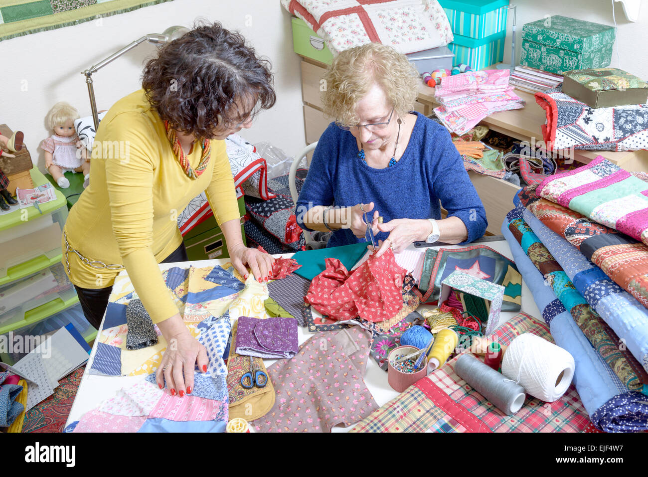two women working on their patchwork in the workshop Stock Photo - Alamy